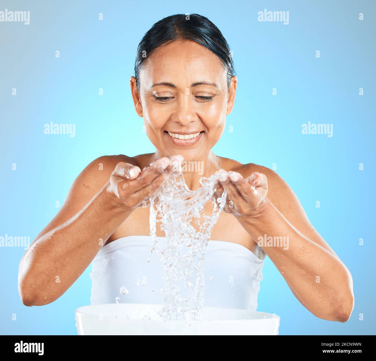 Water splash, skincare and with a woman washing her face for beauty ...