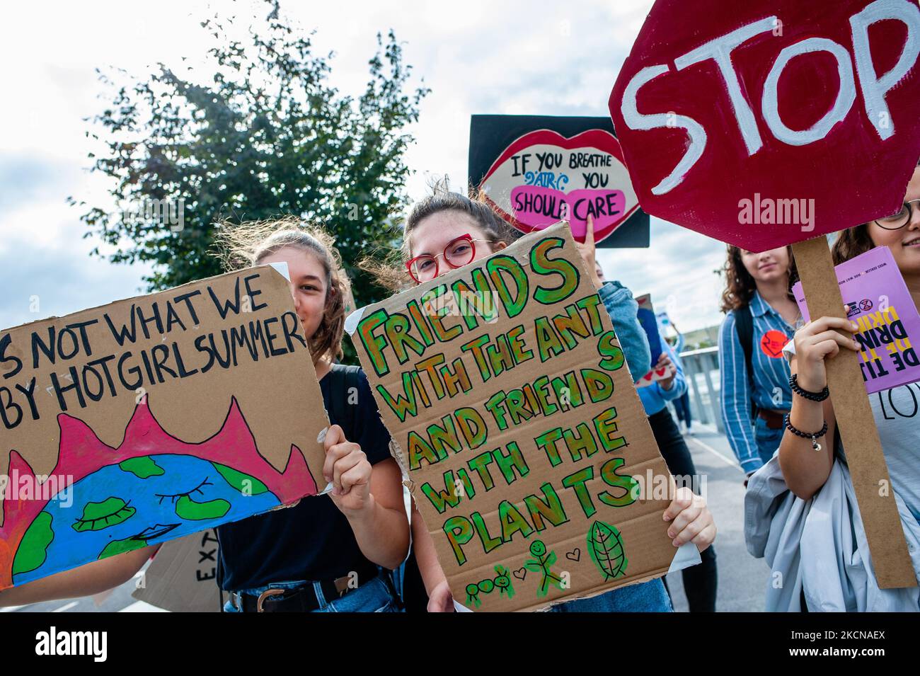 A group of female students are holding placards in support of the ...