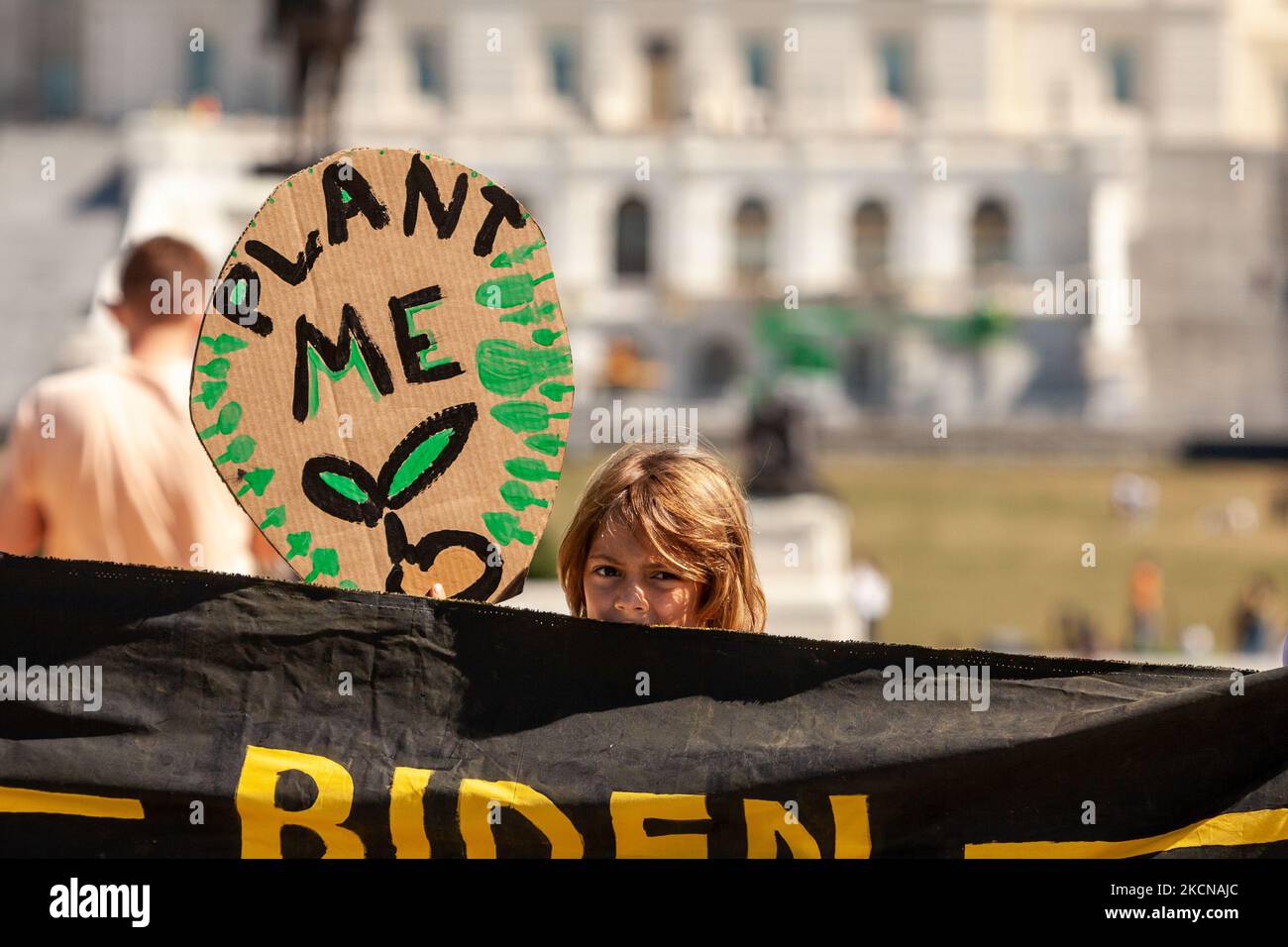 A young protester advocating a green future joins the global climate ...