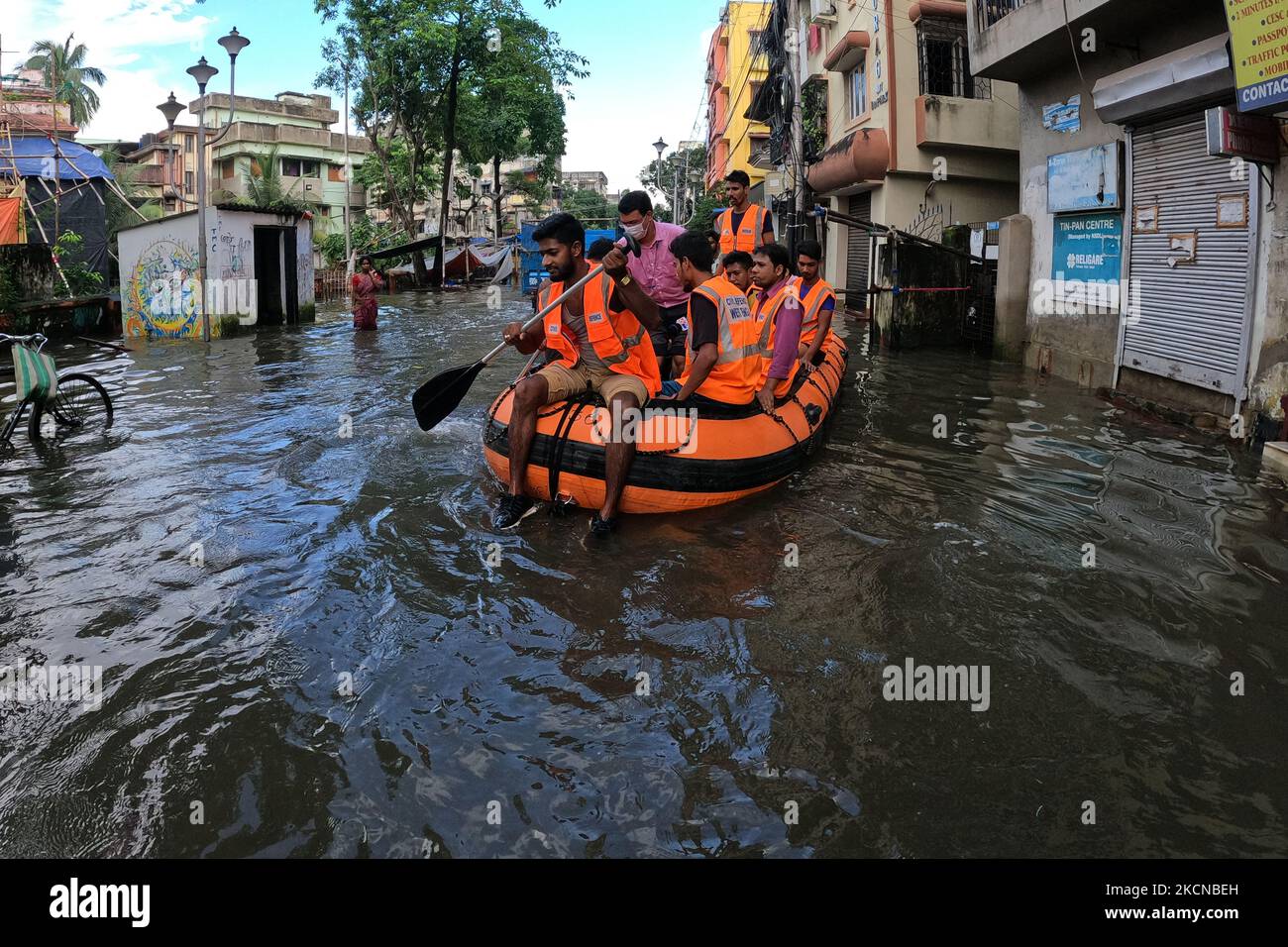 Disaster management team in a boat through the waterlogged area during ...