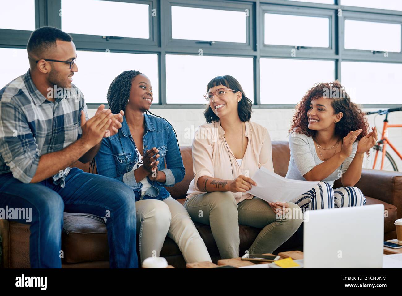 No contribution gets taken for granted. a young woman being applauded ...