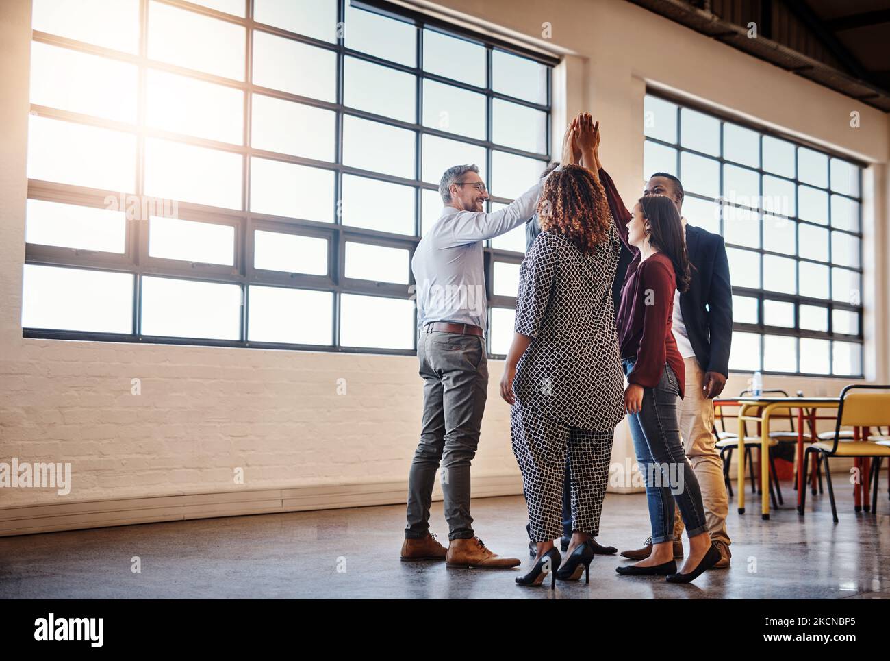 The best in the business. Full length of a diverse team of happy ...