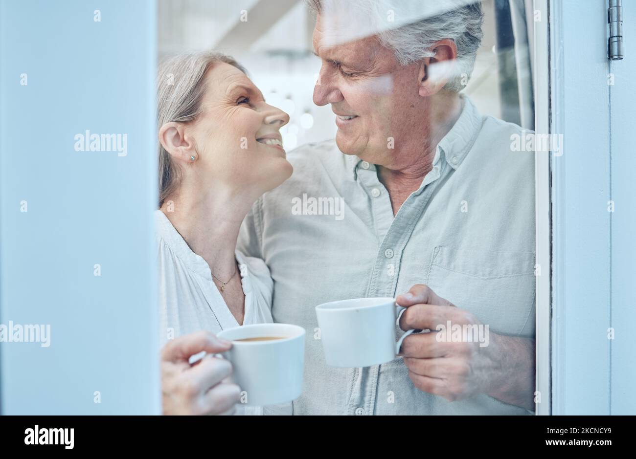 Retirement, coffee and love with a senior couple drinking or enjoying a ...