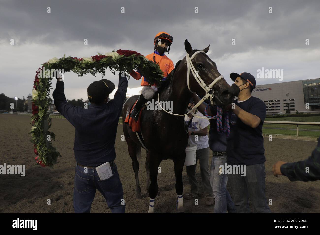 José Luis Campos, jockey (number 7, orange shirt, blue horizontal ...