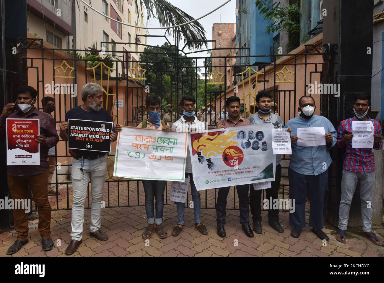 Protesters are seen holding placards as massive protest erupted in ...