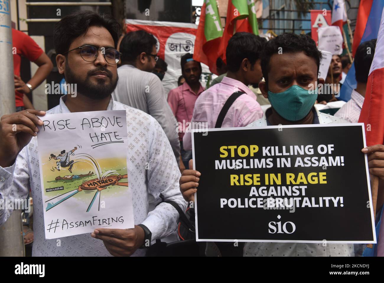Protesters are seen holding placards as massive protest erupted in ...