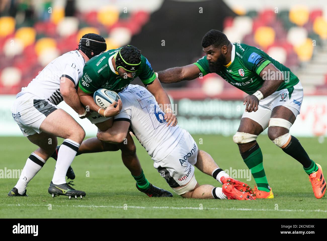 Matt Rogerson of London Irish is tackled by Bevan Rodd and Sam Dugdale ...