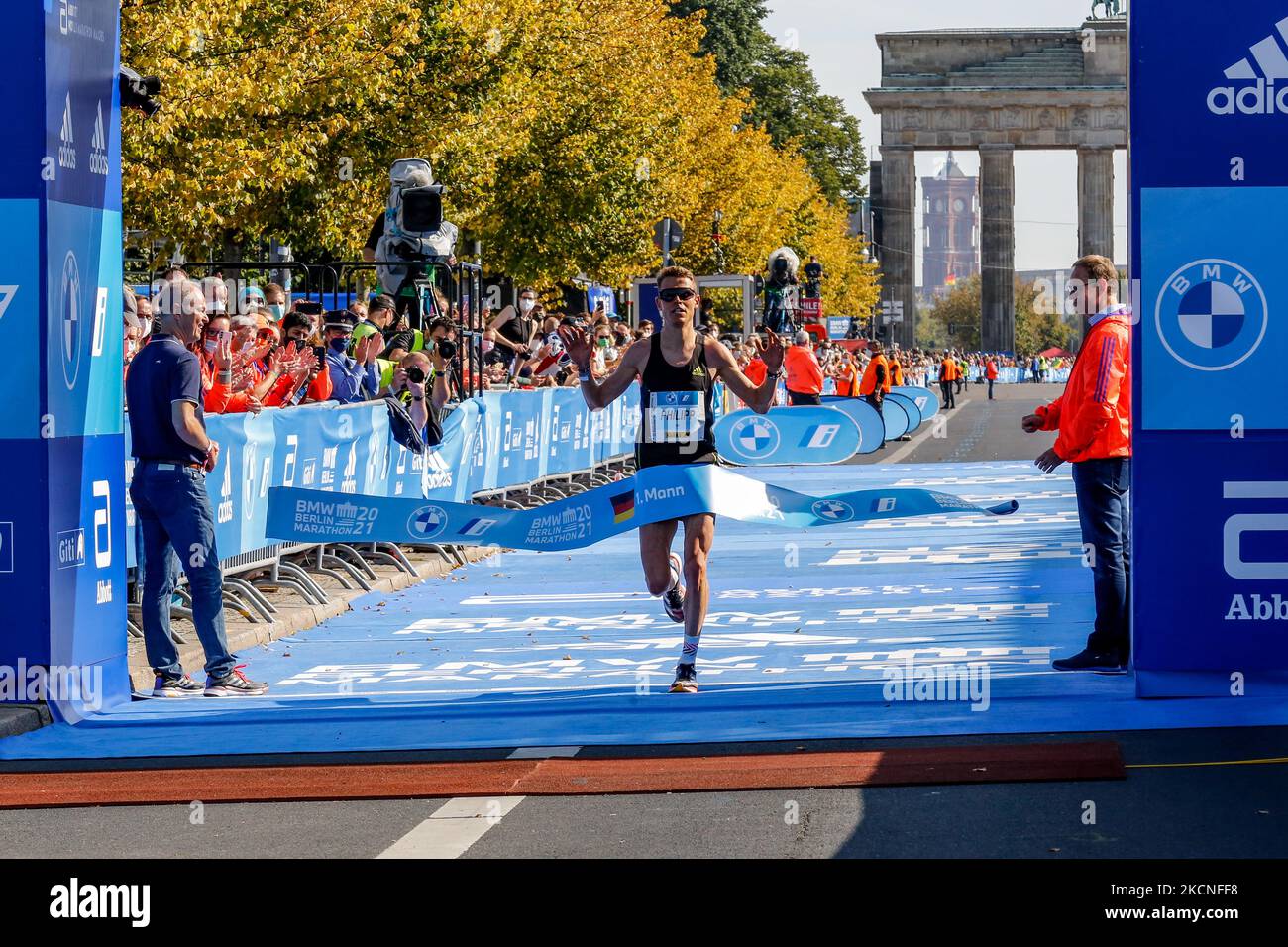 The first German runner, Philipp Pflieger crosses the finish line as ...