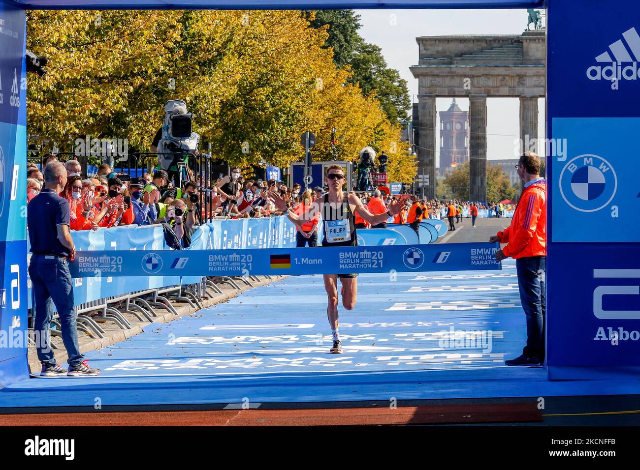 The first German runner, Philipp Pflieger crosses the finish line as ...