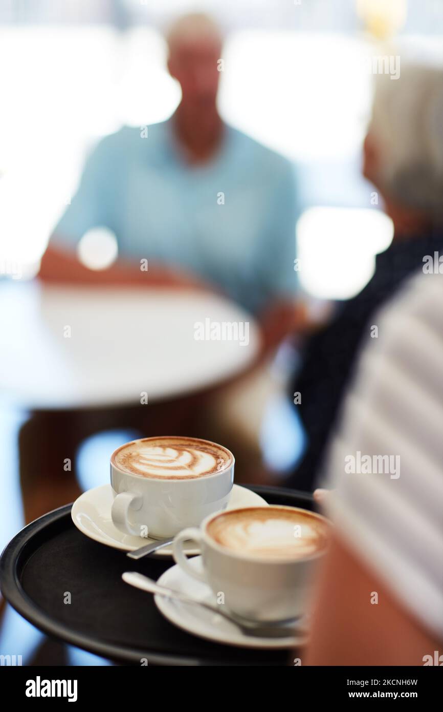 Whats there not to love about coffee. a waitress carrying two coffees ...