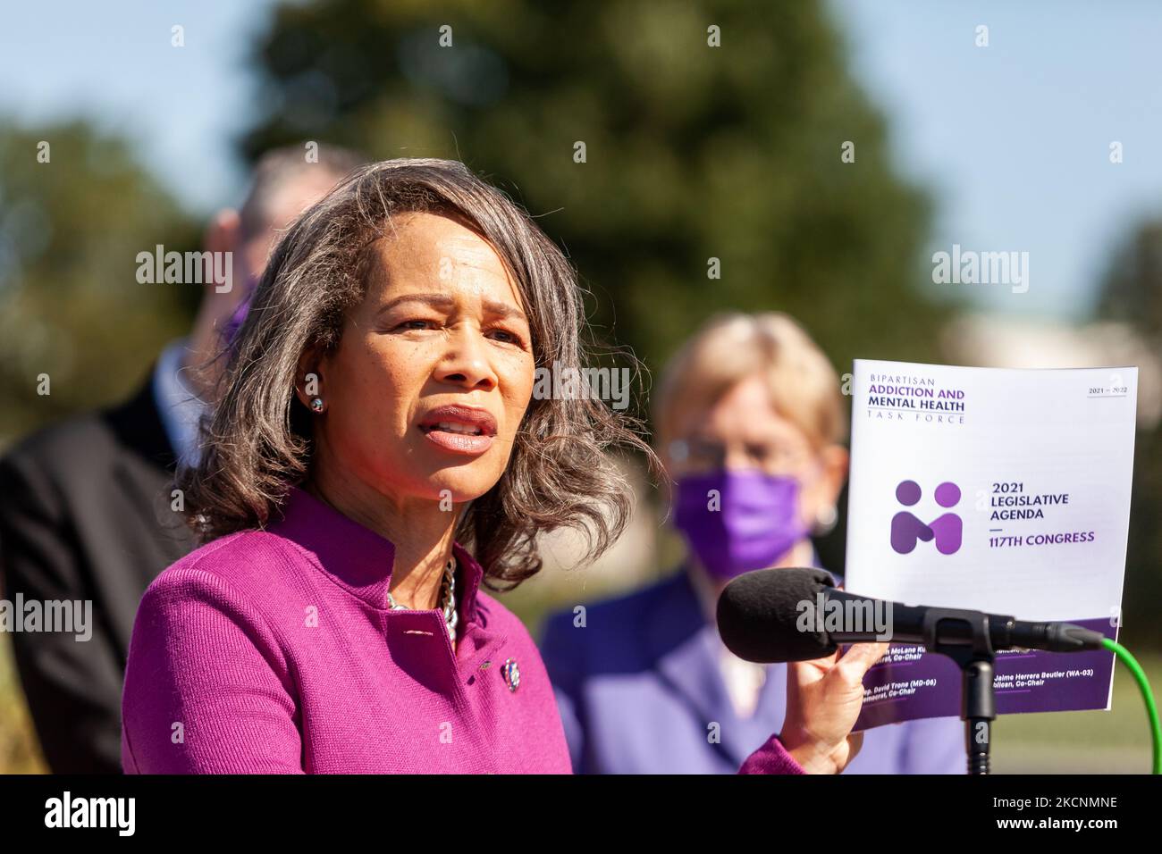 Congresswoman Lisa Blunt Rochester (D-DE) holds up a copy of the 2021 ...