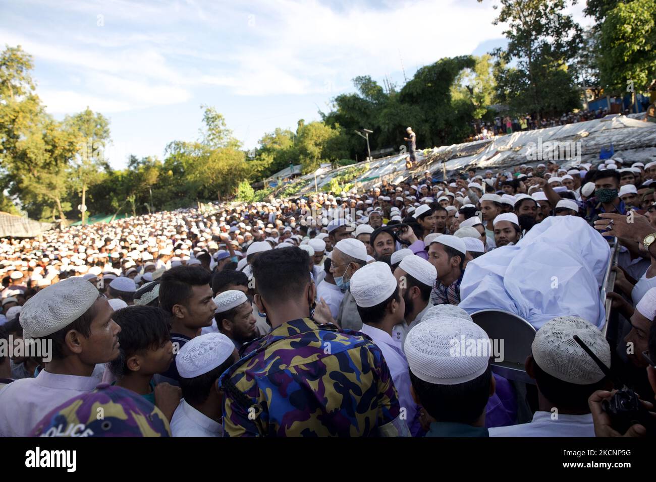 Rohingya people attend the funeral of Rohingya leader Mohibullah in kutupalang refugee camp in ...