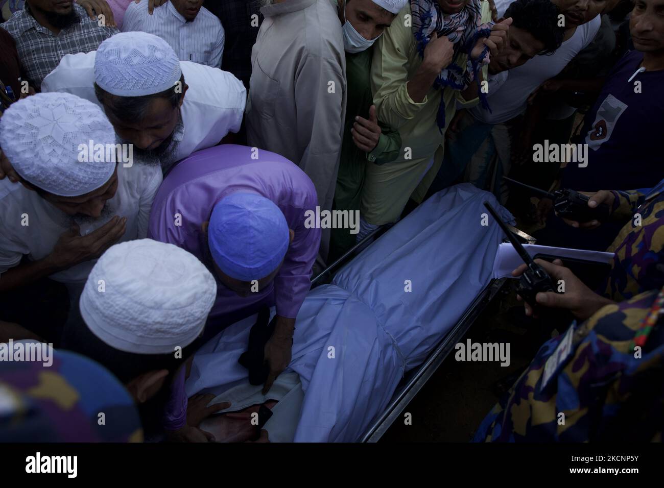 Rohingya people attend the funeral of Rohingya leader Mohibullah in kutupalang refugee camp in ...