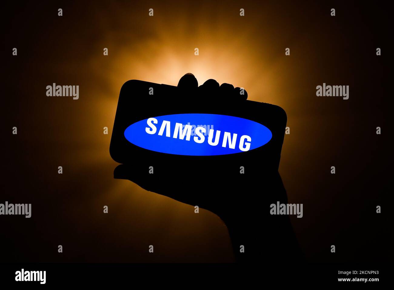 Samsung logo displayed on a phone screen is seen in this illustration ...
