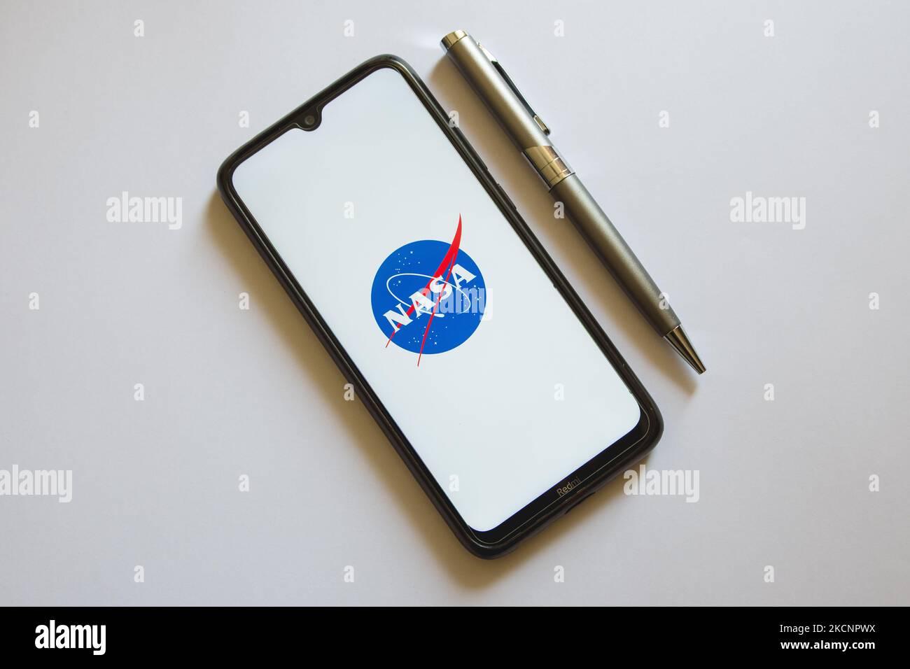 In this photo illustration a NASA logo is display on a smartphone ...
