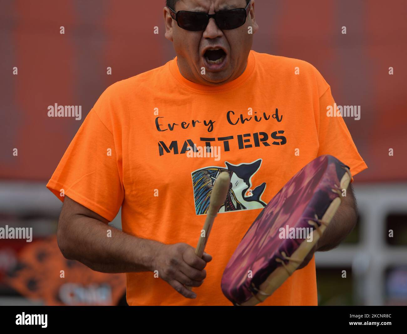 A member of the First Nations performs an indiginius song as the City ...