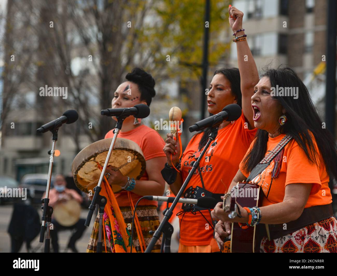 Indigenous musicians led by Wendy Walker (R) perform during an outdoor ...