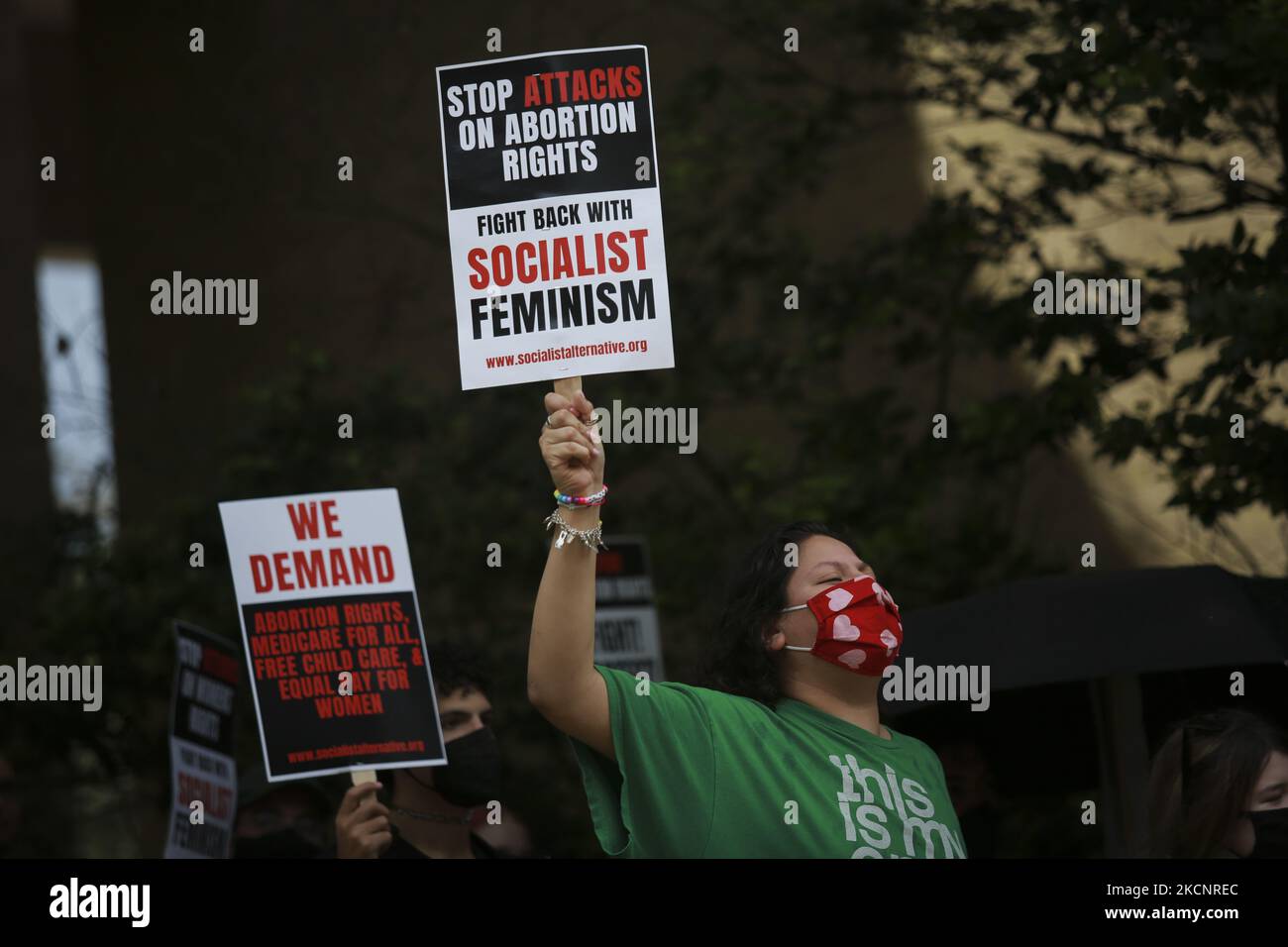 "Stop attacks on abortion rights," one protestor's sign reads on ...
