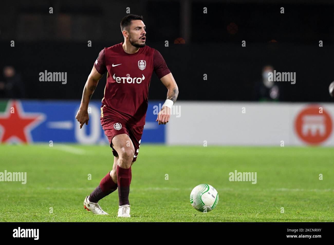 Andrei Burca of CFR 1907 Cluj in action against of Randers FC during ...