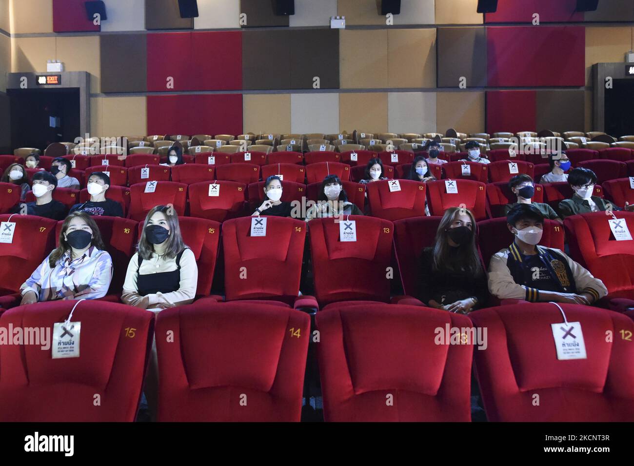 Shopping mall staff sit inside a cinema theater to demonstrate ...