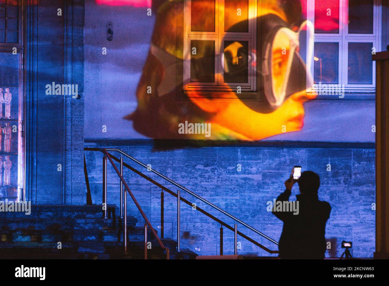 a man takes pictures in front of Opera house in Essen during the Essen ...