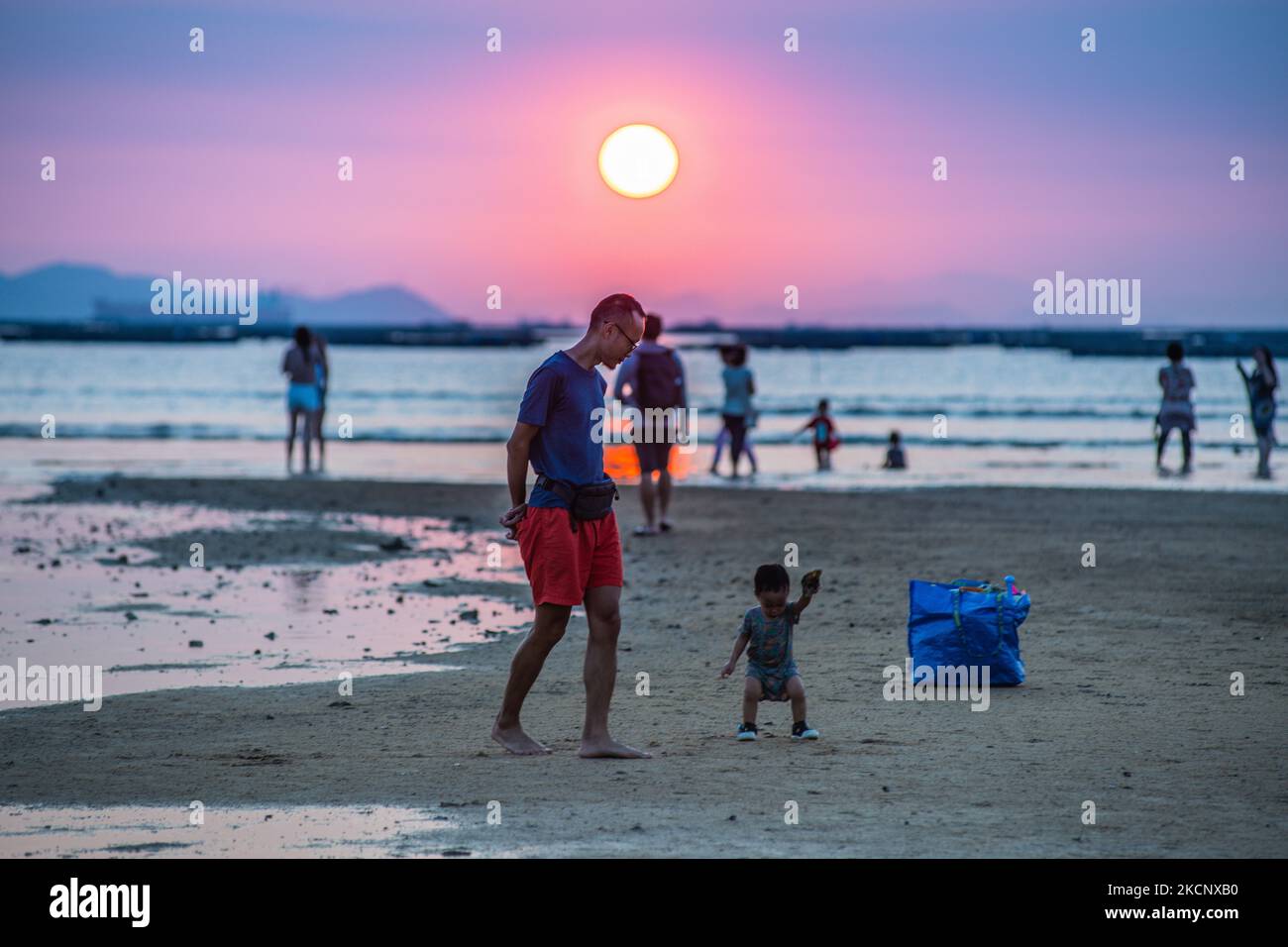 Hong Kong, China, 2 Oct 2021, People enjoy the sunset on Ha Pak Nai ...