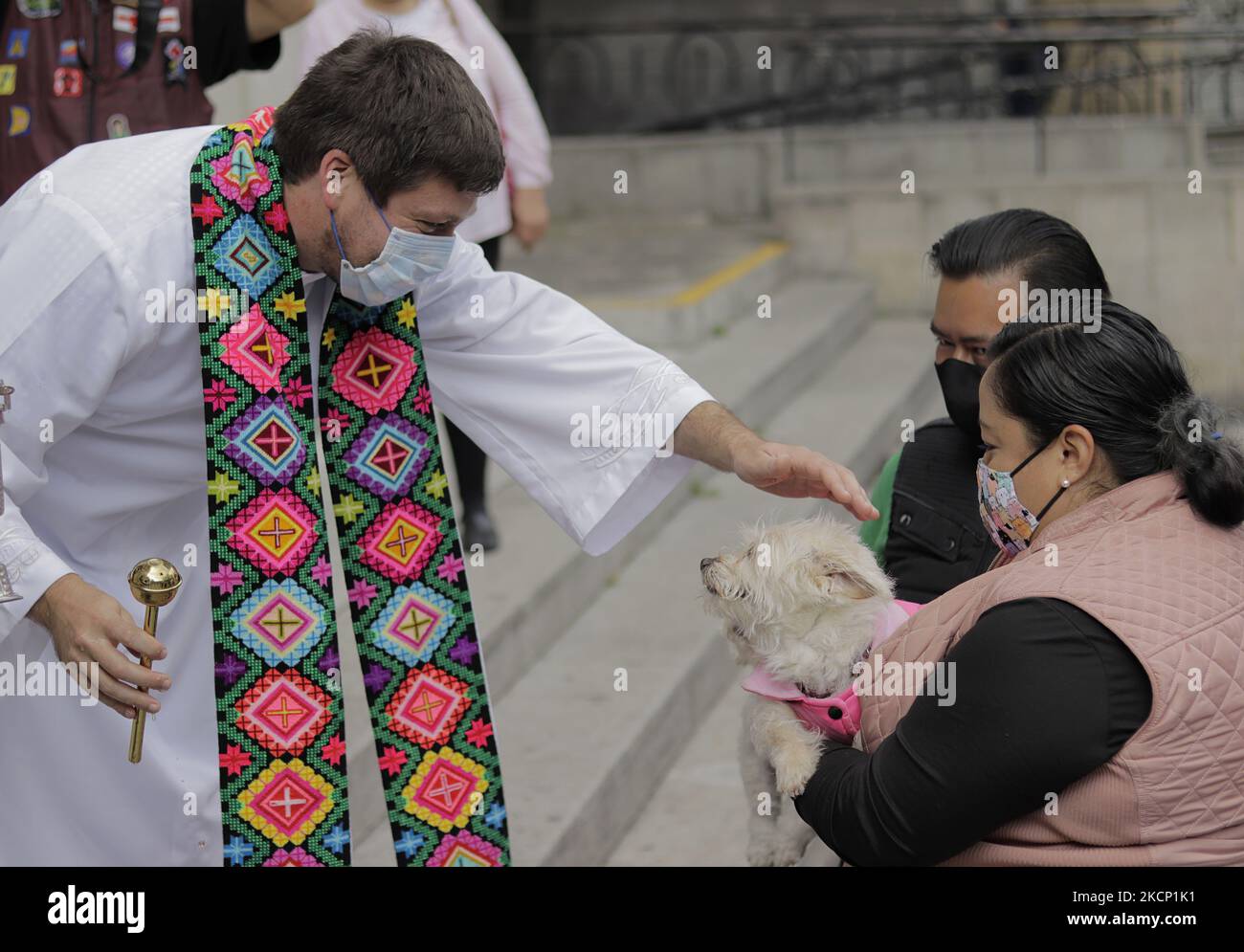 A priest outside the Holy Family Parish in Colonia Roma, Mexico City ...