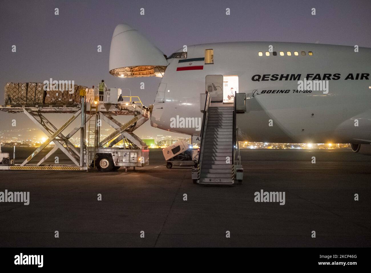Iran’s humanitarian supplies are loaded into an Iranian Qeshm Fars ...