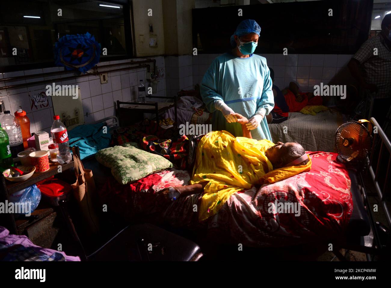 A doctor checks a patient in the general ward at National Institute of ...