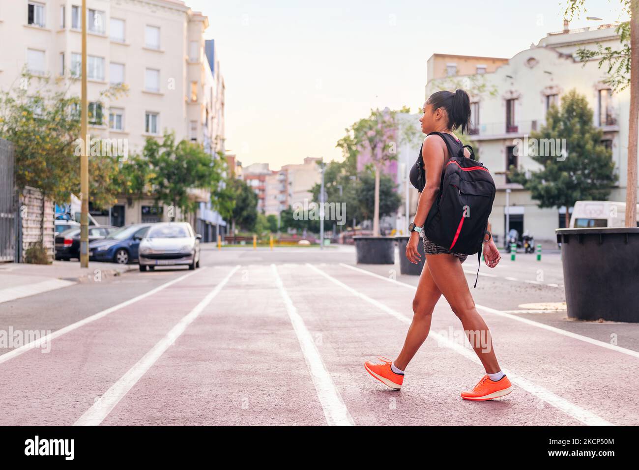 latina female athlete walking on a running track Stock Photo - Alamy