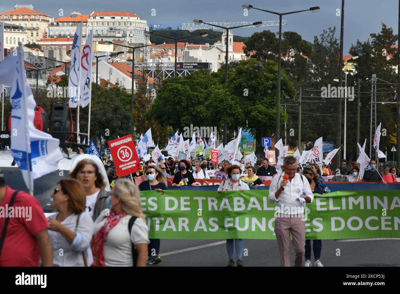 Activists from the teachers' union display banners in support of teachers' welfare demands ...