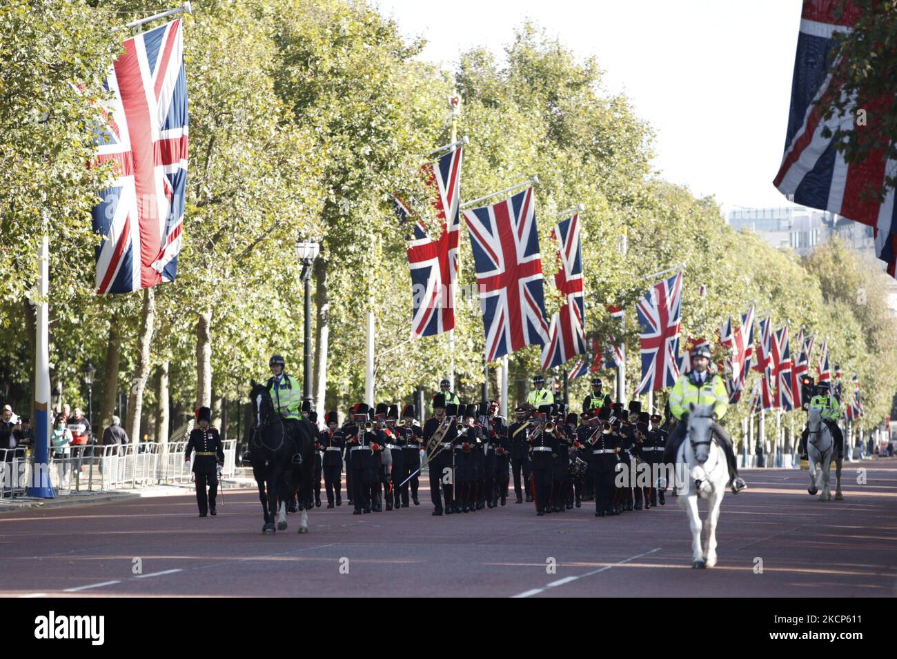 Members of the Royal Regiment of Canadian Artillery march along The Mall from St James's Palace ...