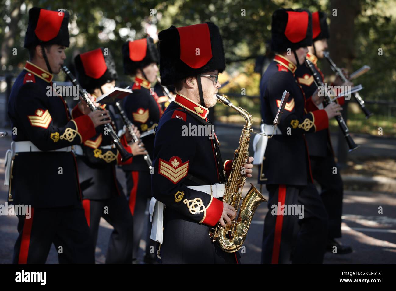 Band members of the Royal Regiment of Canadian Artillery march from Buckingham Palace to ...