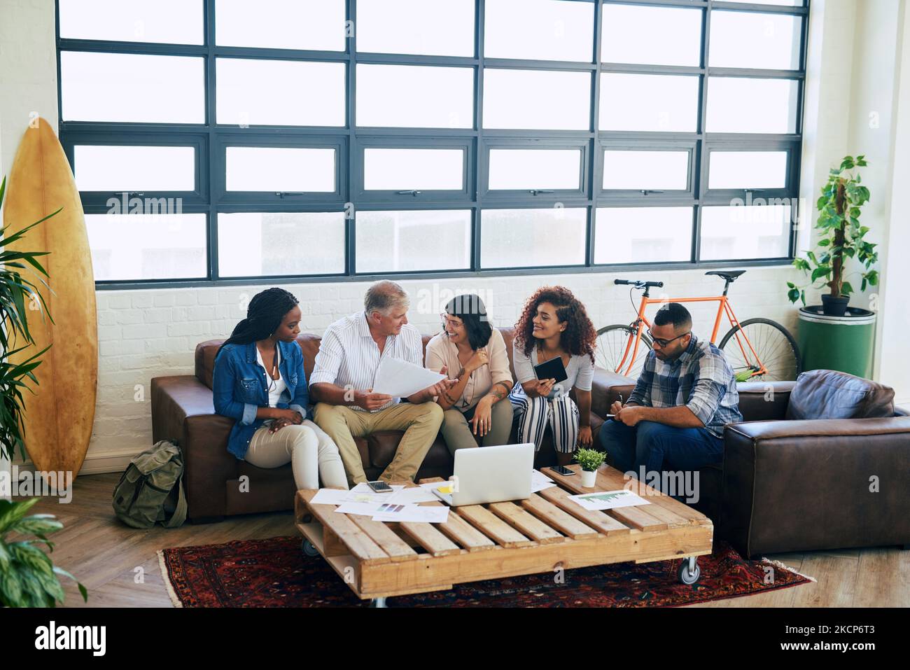 Managing and inspiring a team. Thats how its done. a group of colleagues collaborating in a ...