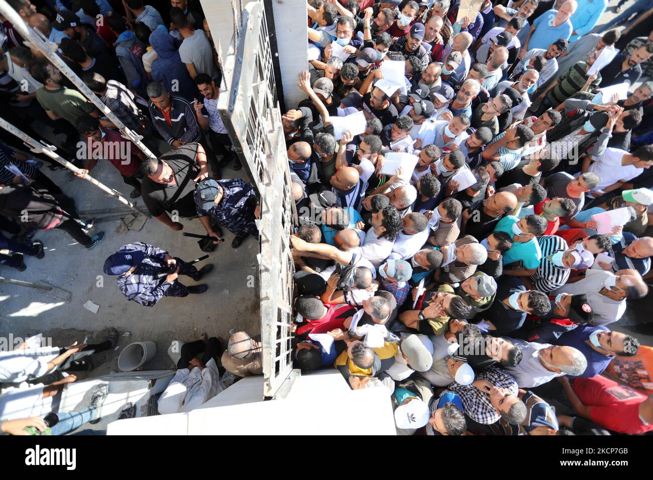 Palestinians apply for Israeli work permits in Deir Al-Balah city in ...