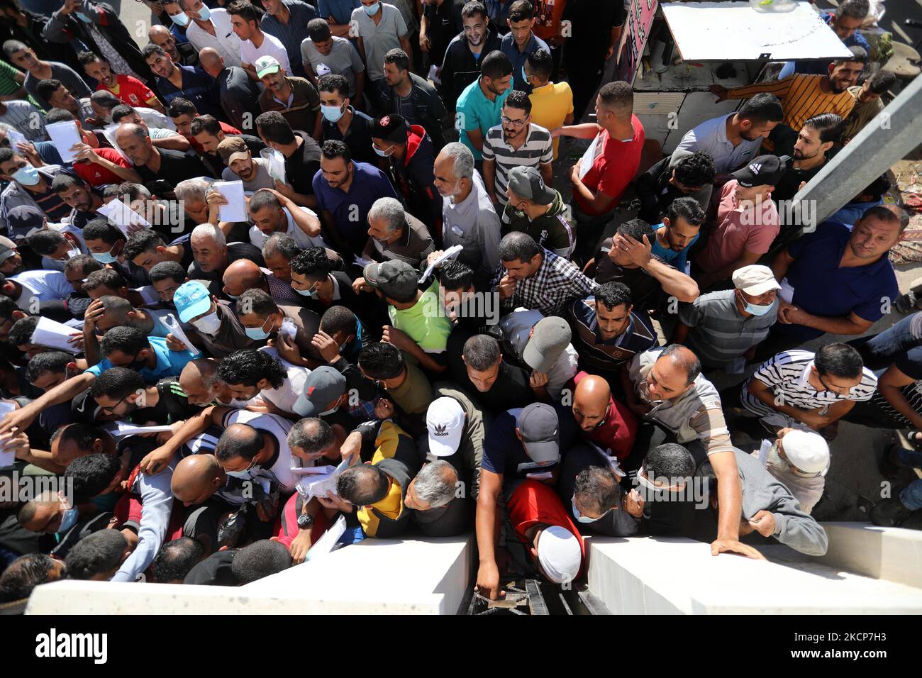 Palestinians apply for Israeli work permits in Deir Al-Balah city in ...