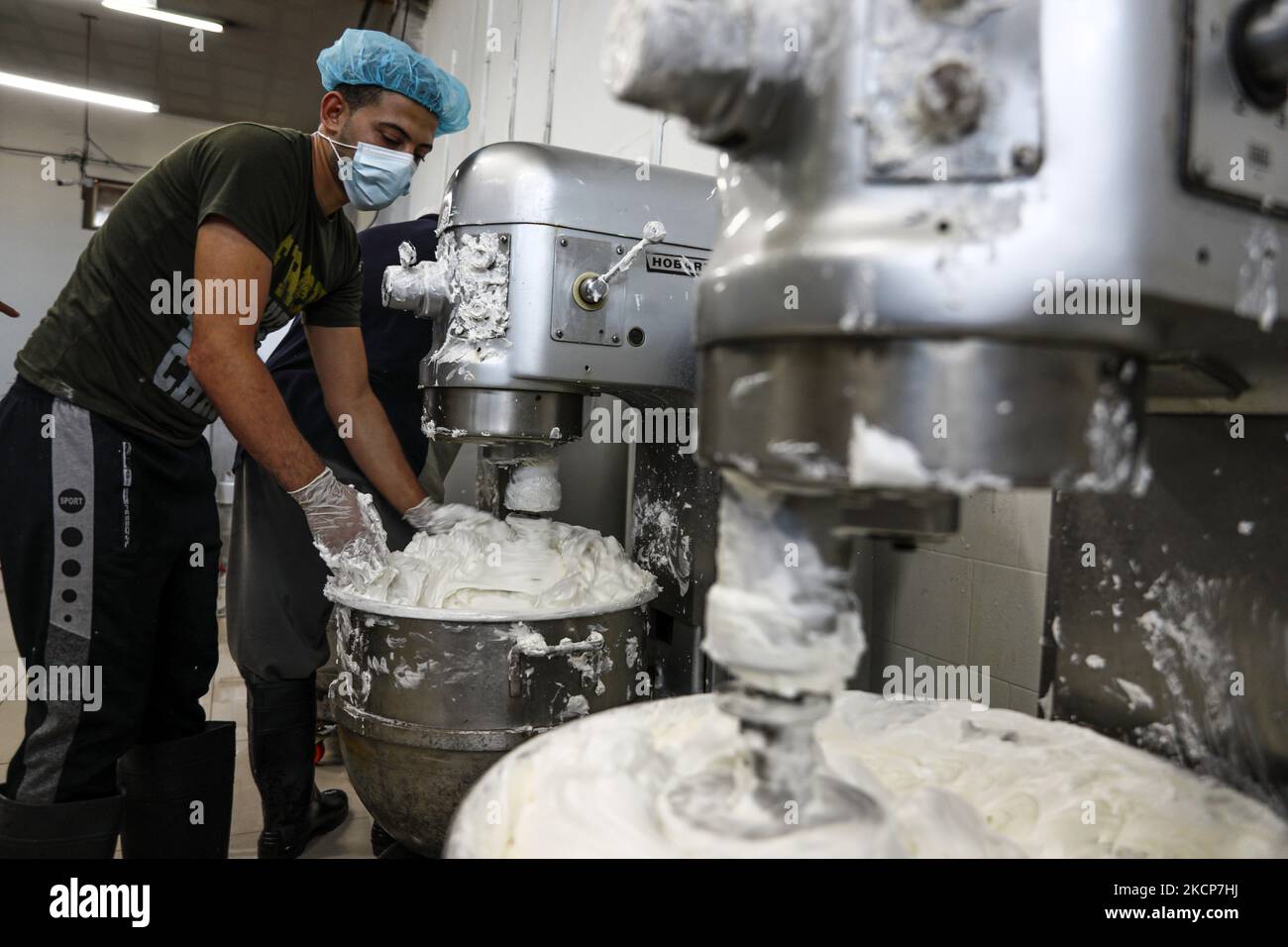 Palestinian workers prepare the vanilla candy known as "crimbo or Ras ...