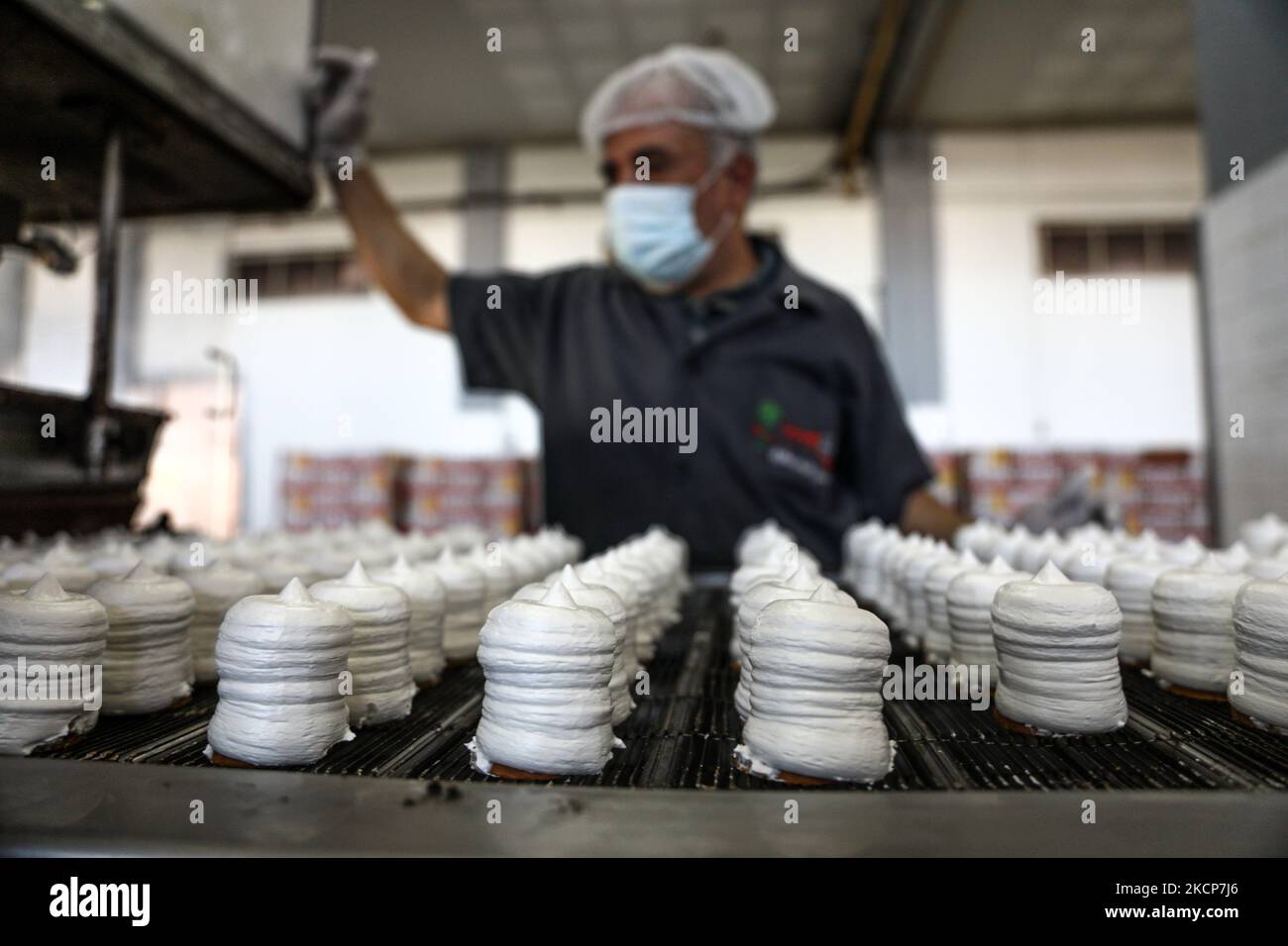 Palestinian workers prepare the vanilla candy known as "crimbo or Ras ...