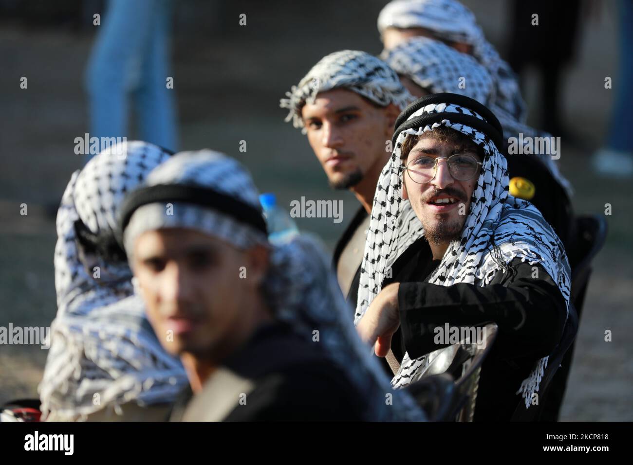 Palestinians participate in a wedding simulating traditional ...