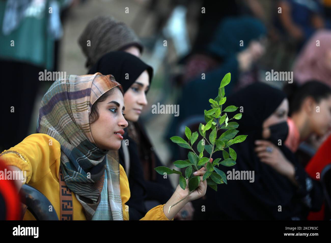 Palestinians participate in a wedding simulating traditional ...