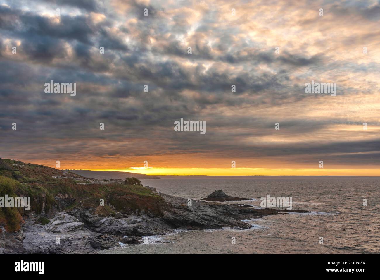 Moody landscape sunrise image at Prussia Cove in Cornwall England with ...