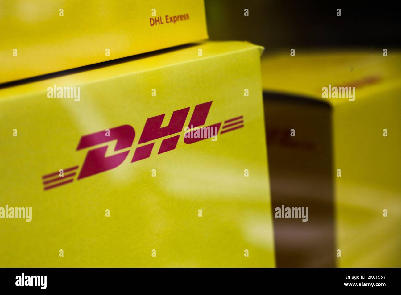 DHL logo is seen on a shipping box in the service point in Milan, Italy ...