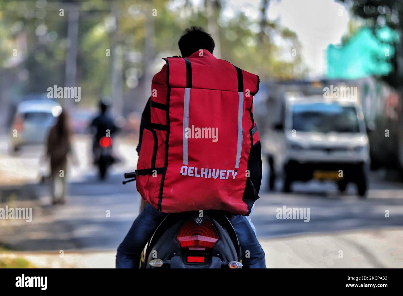 Delhivery delivery service delivery boy is seen with parcels (Photo by ...