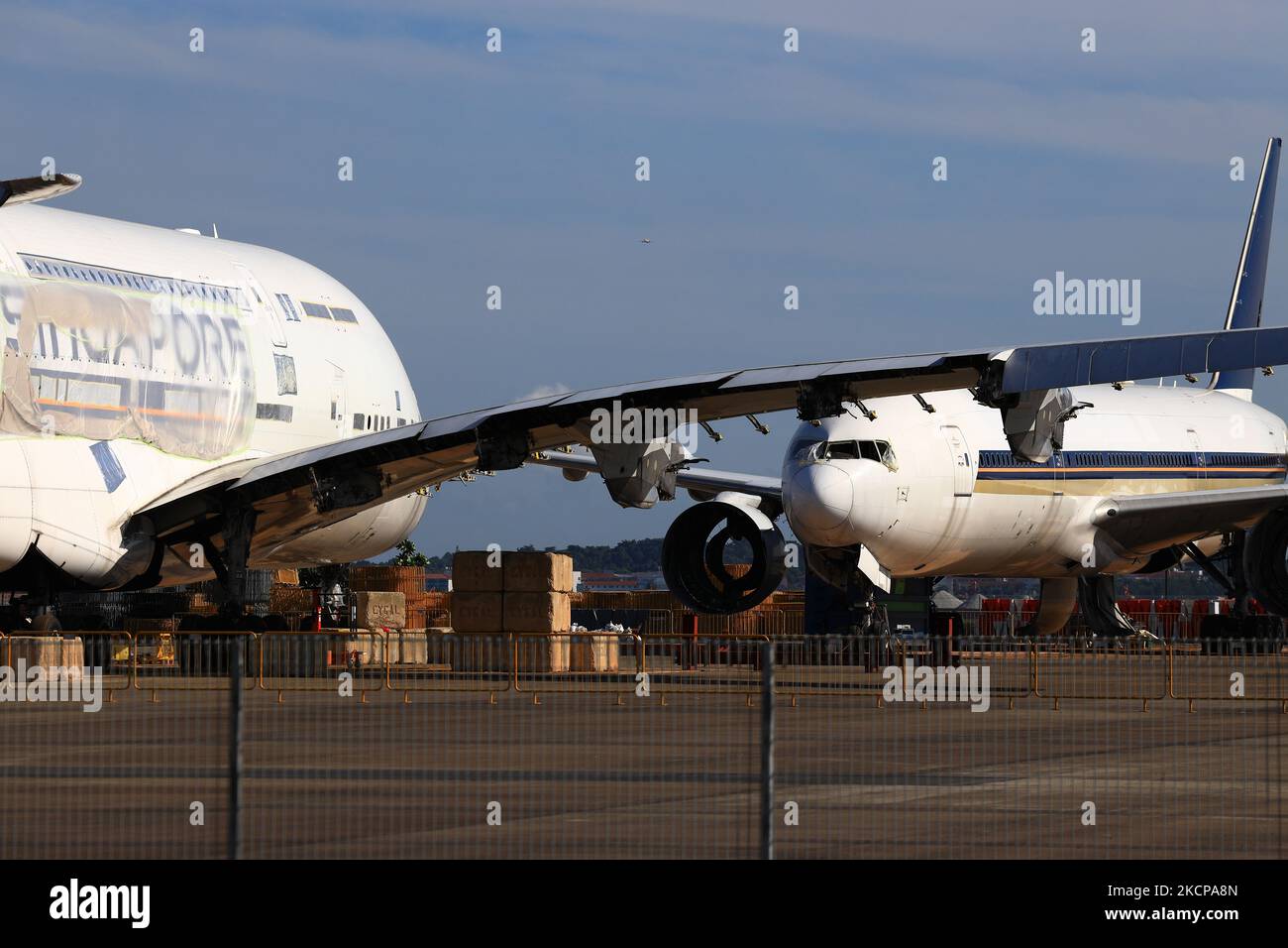 Singapore Airlines (SIA) Airbus A380 (L) and Boeing 777-200ER are seen ...