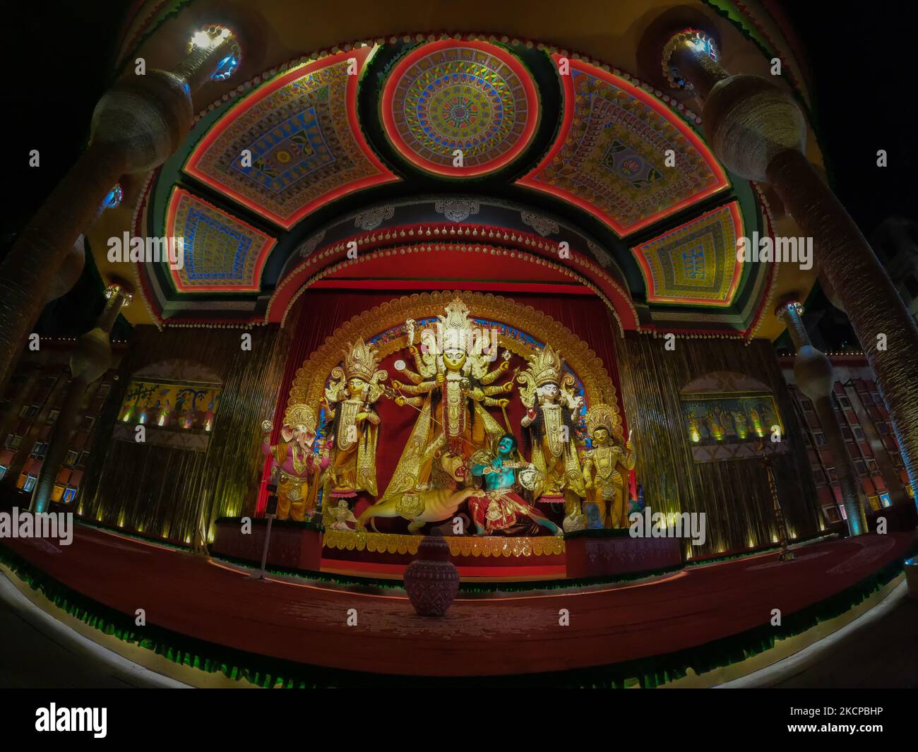 An idol of the Goddess Durga is seen on a makeshift place of worship on ...