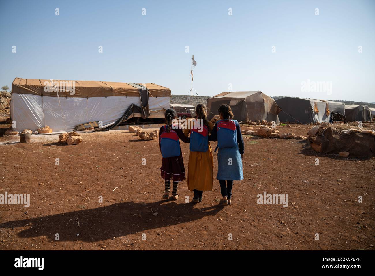 Children attend the first day of school in a refugees camp in the ...