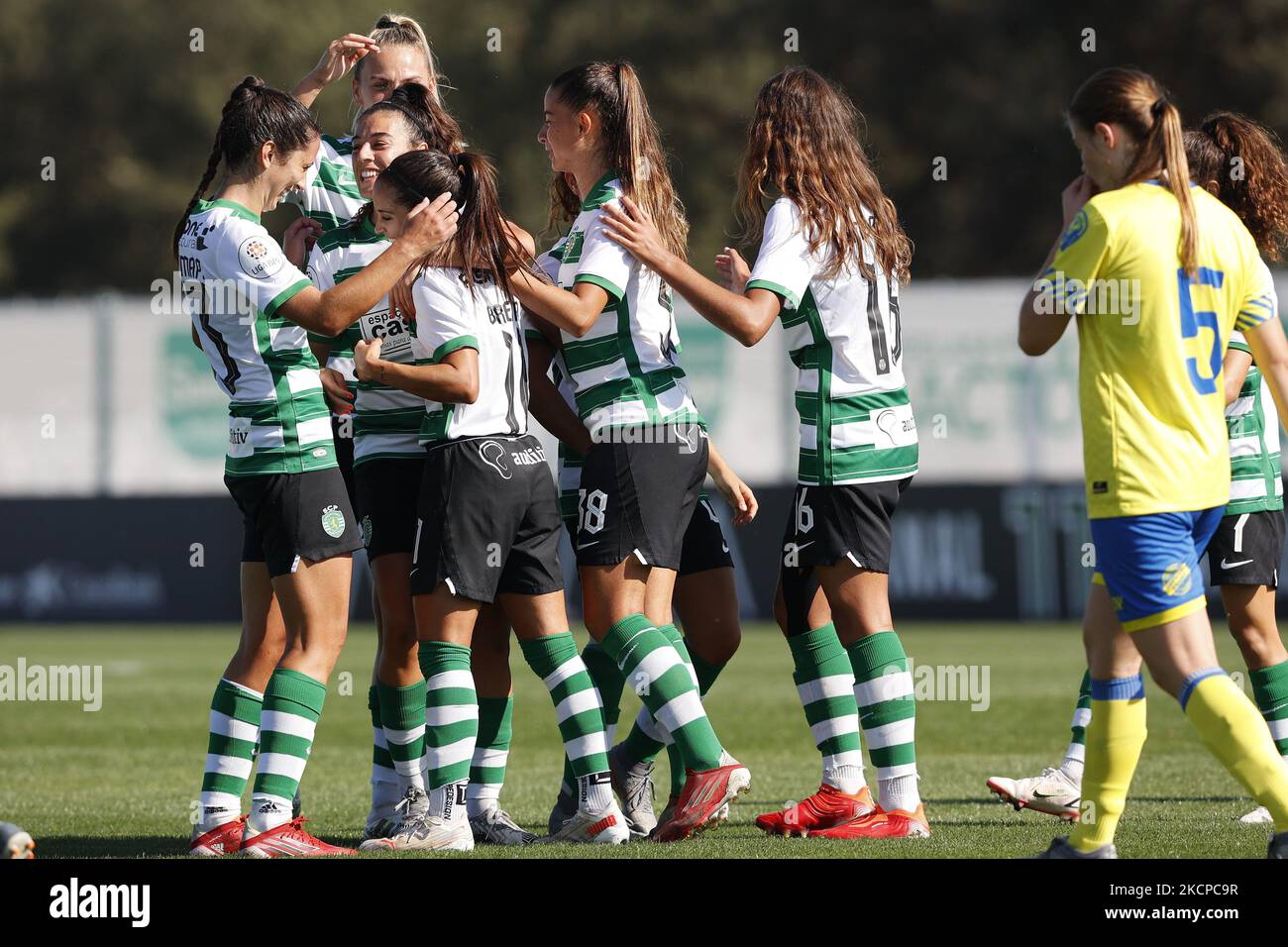 Brenda Perez celebrates her goal with teammates during the match for ...