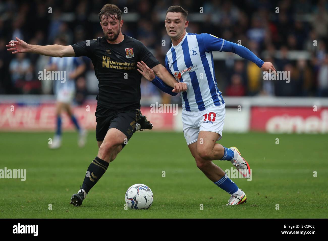 Jack Sowerby of Northampton Town battles for possession with Hartlepool ...