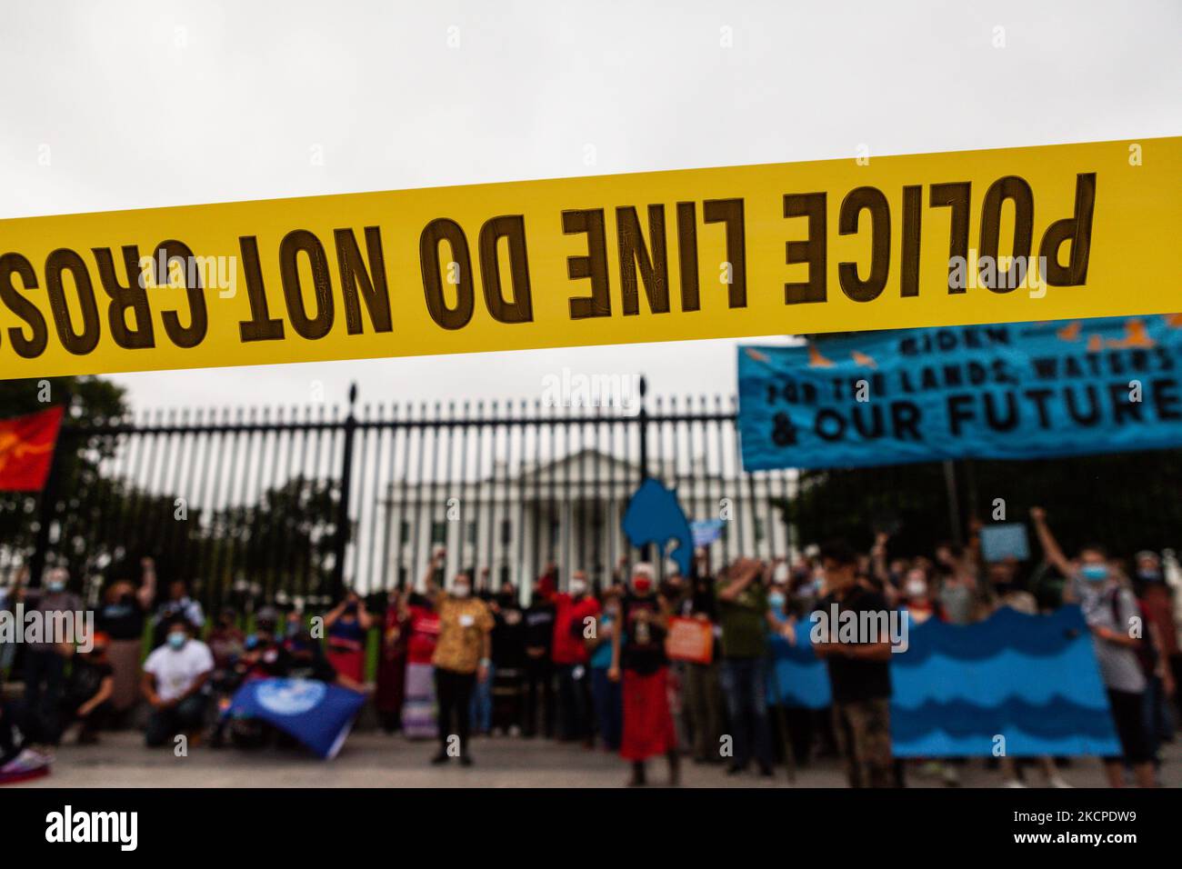 Native American activists and allies await arrest during a protest at ...