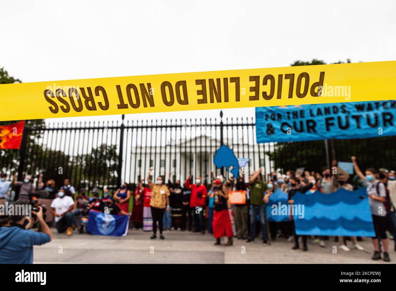 Native American activists and allies await arrest during a protest at ...